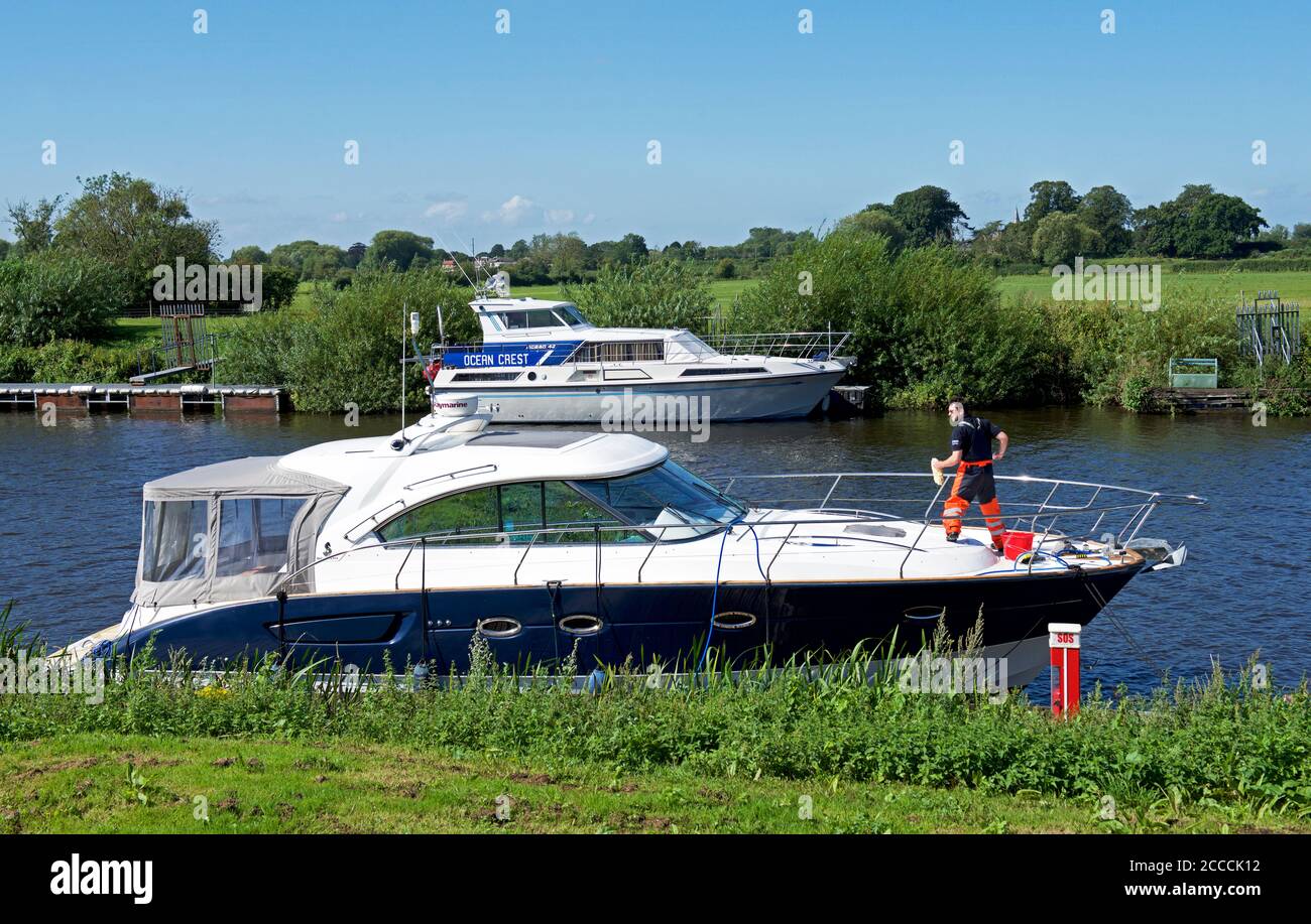 Young man washing boat at the York Marina, Naburn, near York, North ...