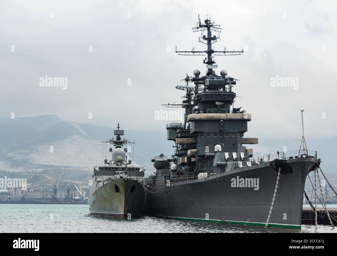 Two military ships in a harbor Stock Photo - Alamy