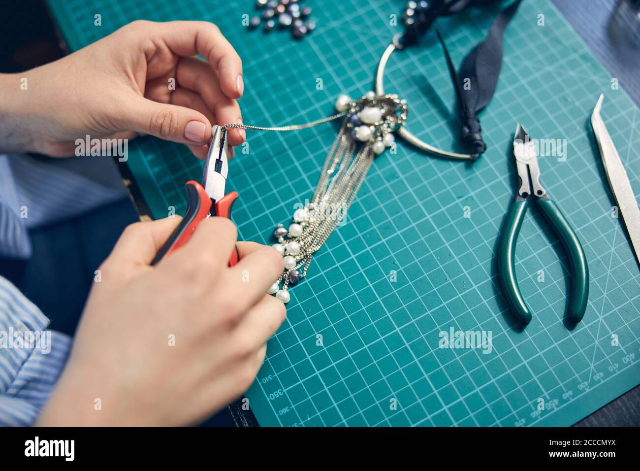 Accurate work of jewel employee with a tool Stock Photo - Alamy