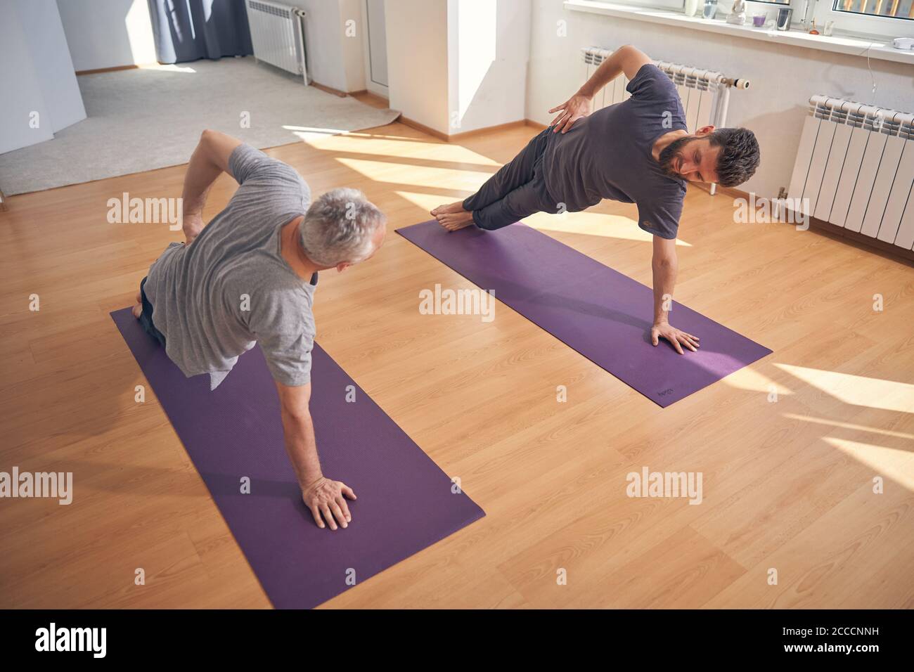 Side plank pose men hi-res stock photography and images - Alamy