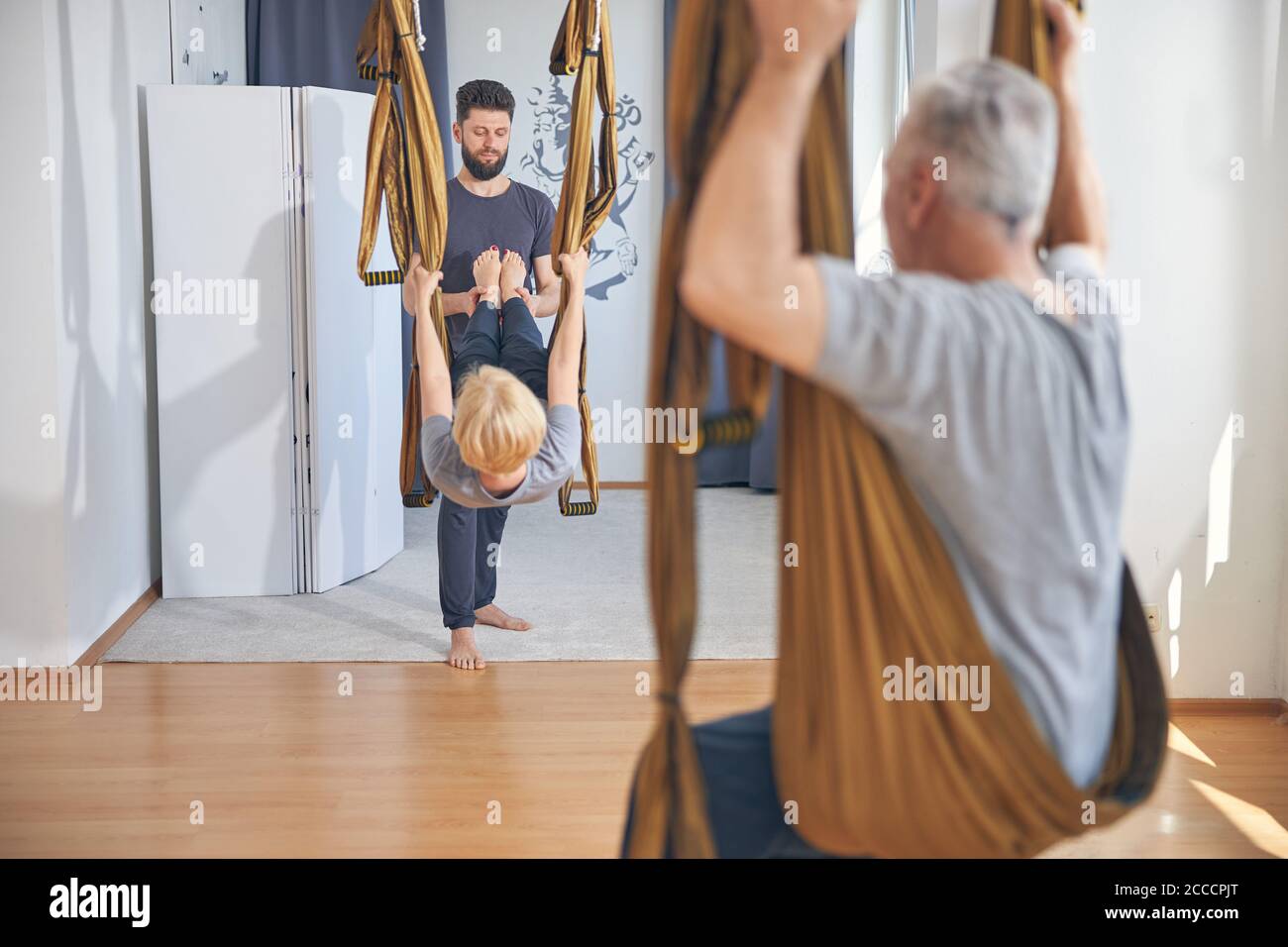 Focused caucasian male instructor female hi-res stock photography and ...