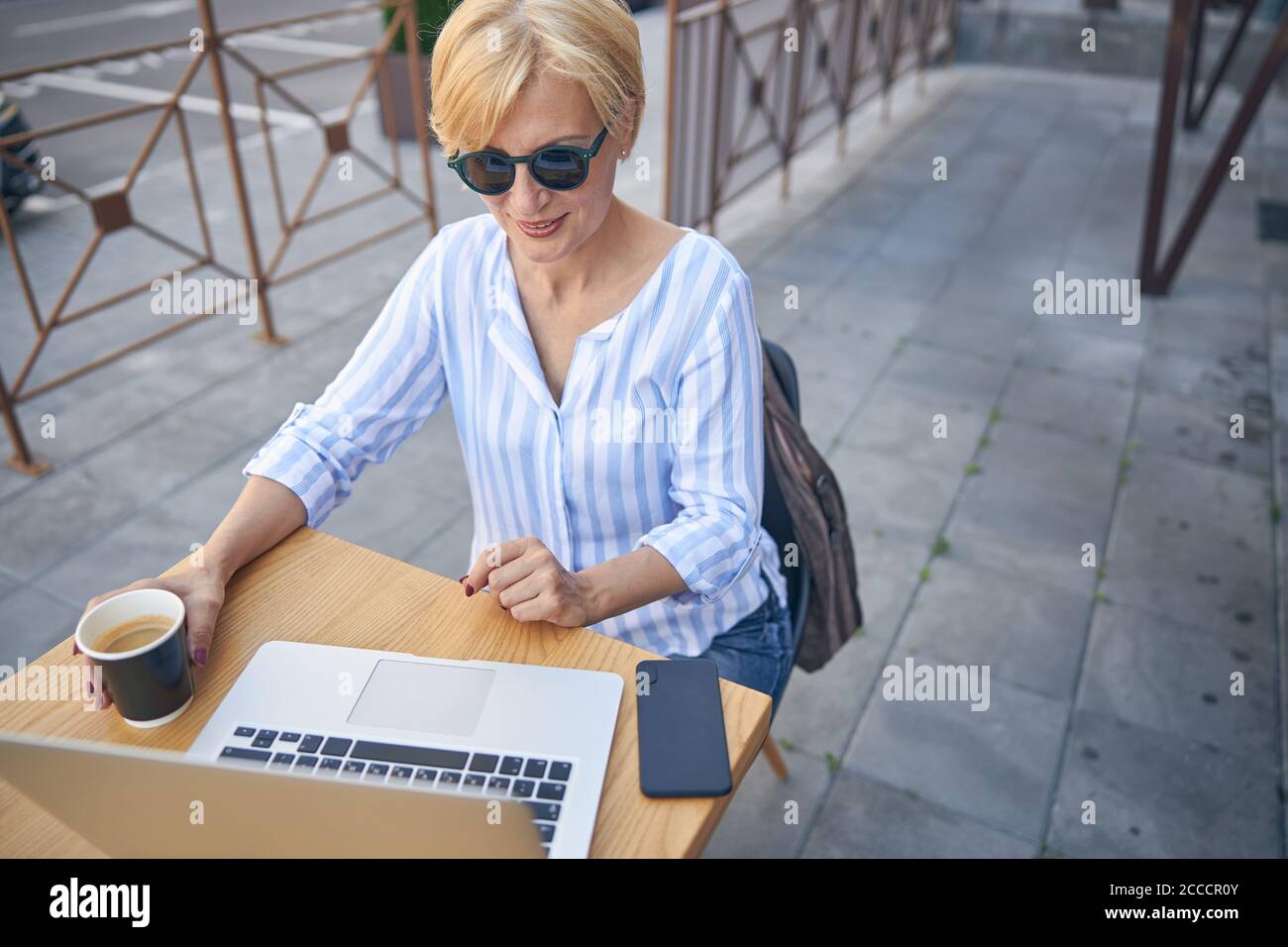 Business lady staring at the laptop screen Stock Photo - Alamy
