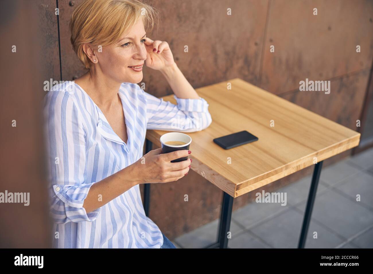 Woman leaning on elbow hi-res stock photography and images - Alamy