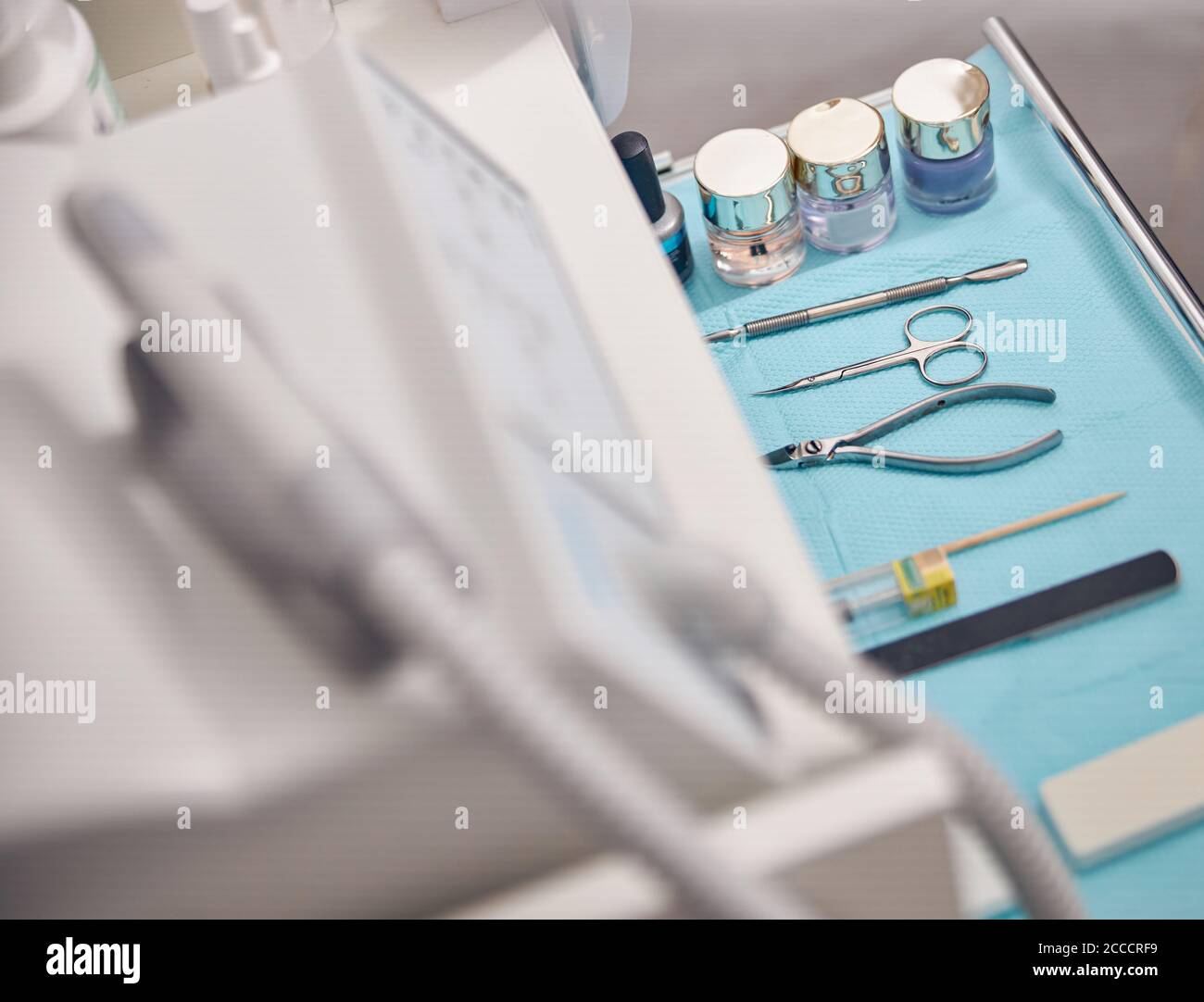 Instruments and digital machine for nail care Stock Photo - Alamy