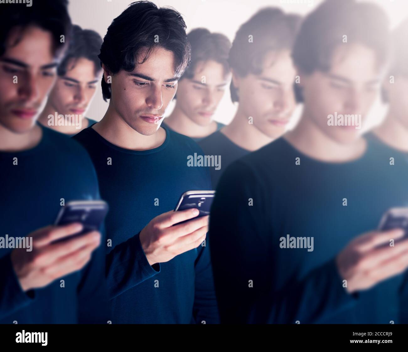 Group of clones looking at their smartphones, all in the same position ...