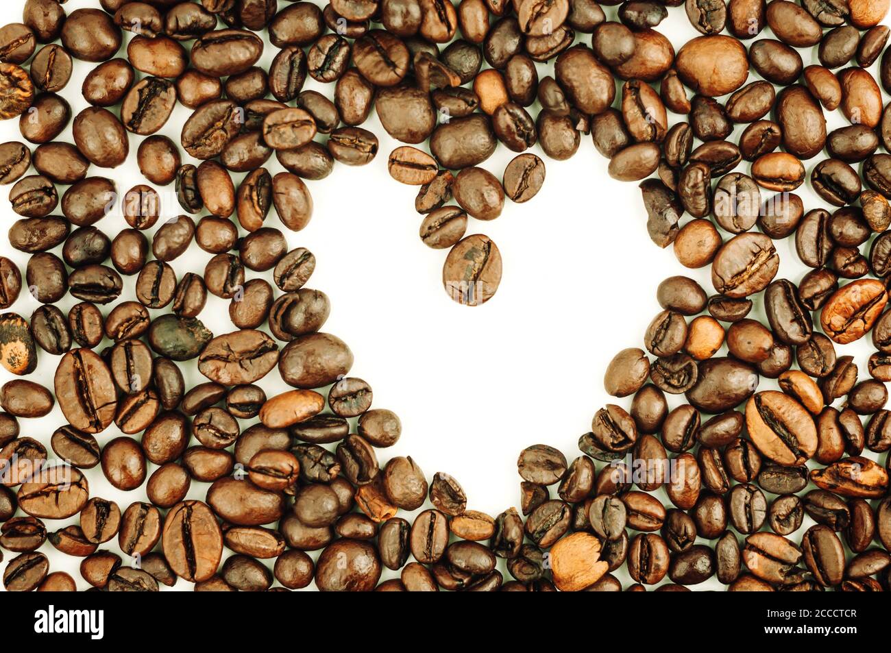 brown heart shaped texture background from roasted coffee beans can be ...