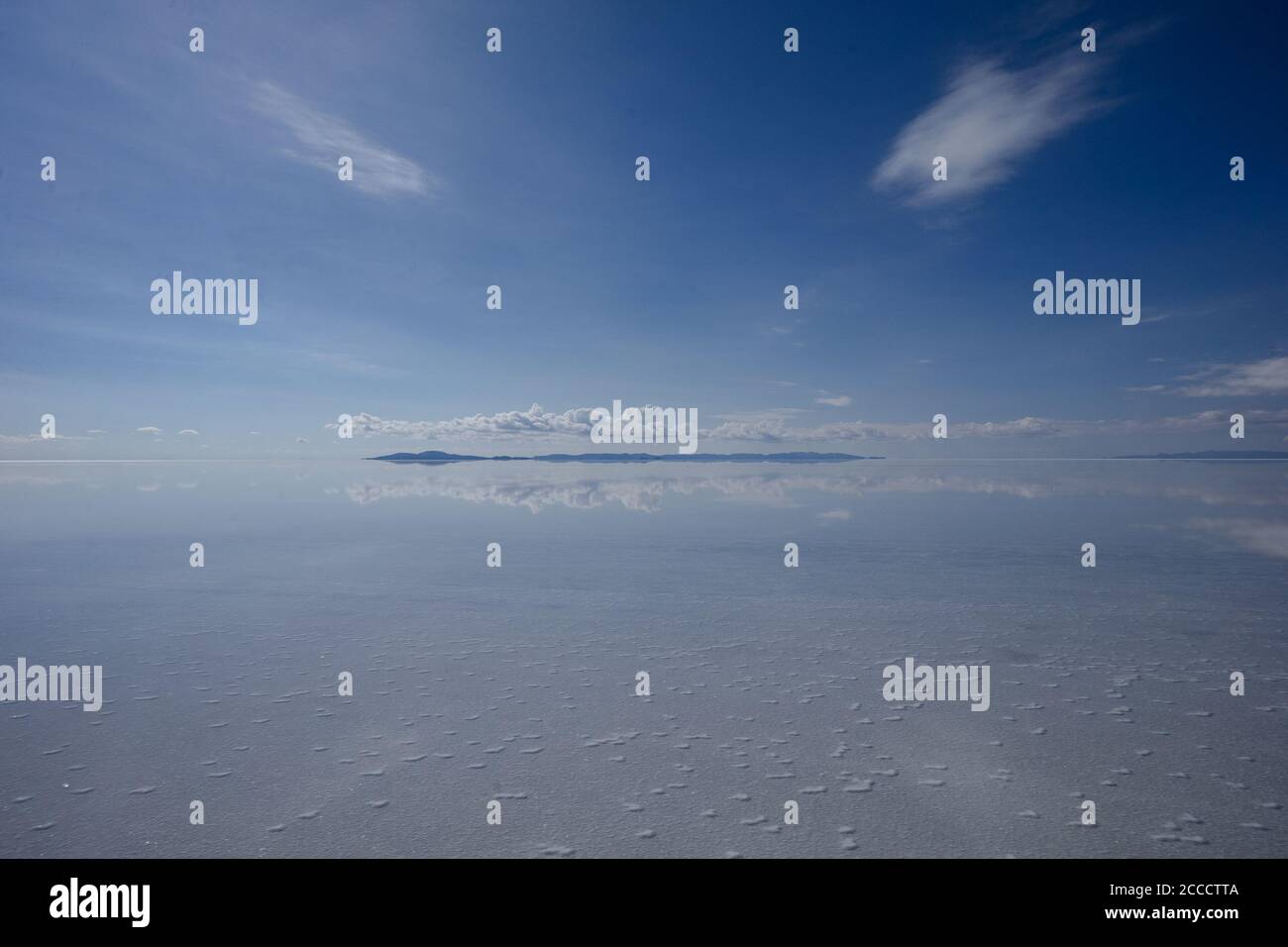 Salt flats mountain reflection Stock Photo - Alamy