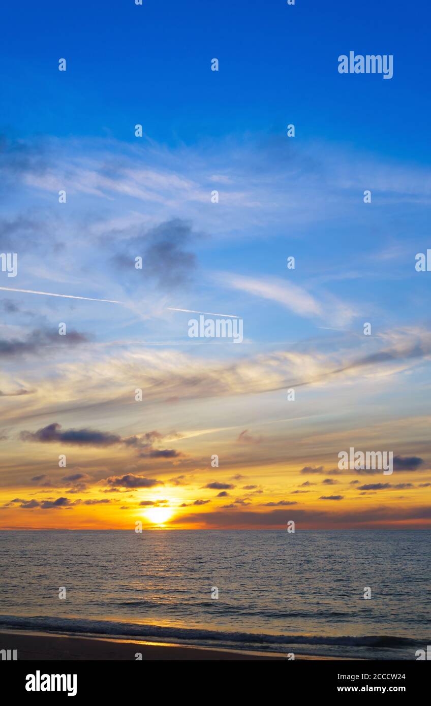 Sunset over the sea. Reflection of sunlight in the sea waves. Red sky ...