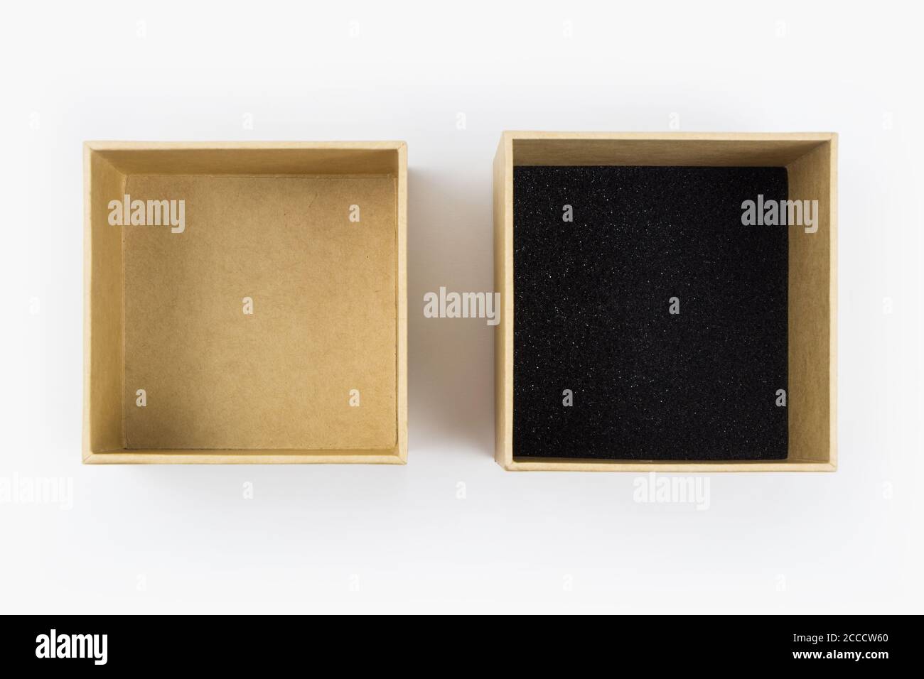 Two square cardboard boxes isolated on white Stock Photo - Alamy