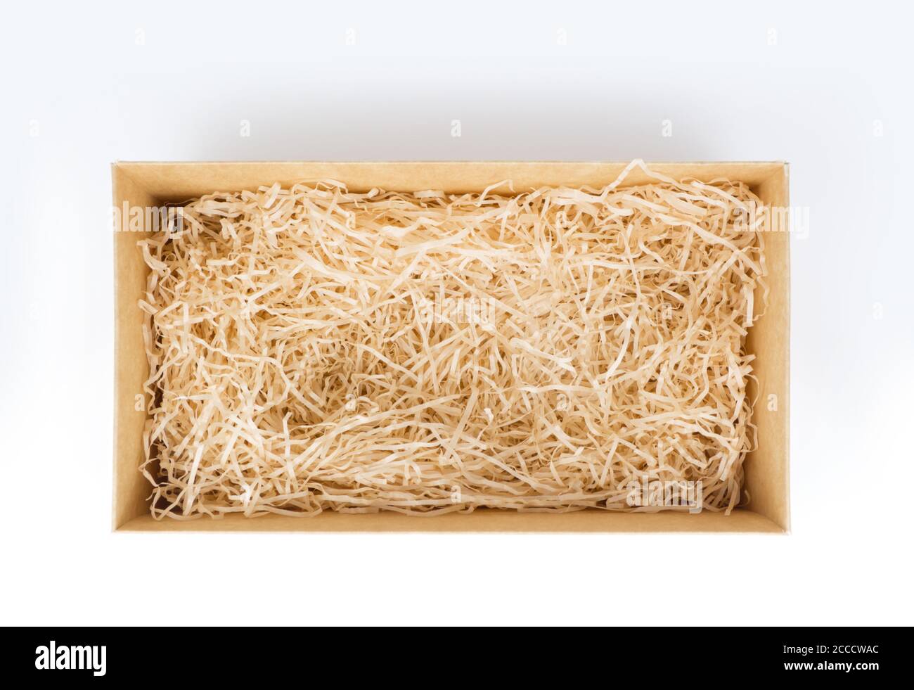Open gift box with decorative straw Stock Photo - Alamy