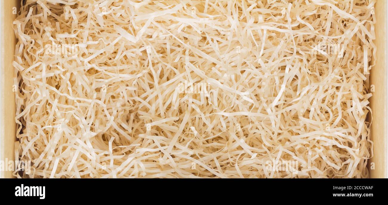Box with decorative straw, closeup background Stock Photo - Alamy