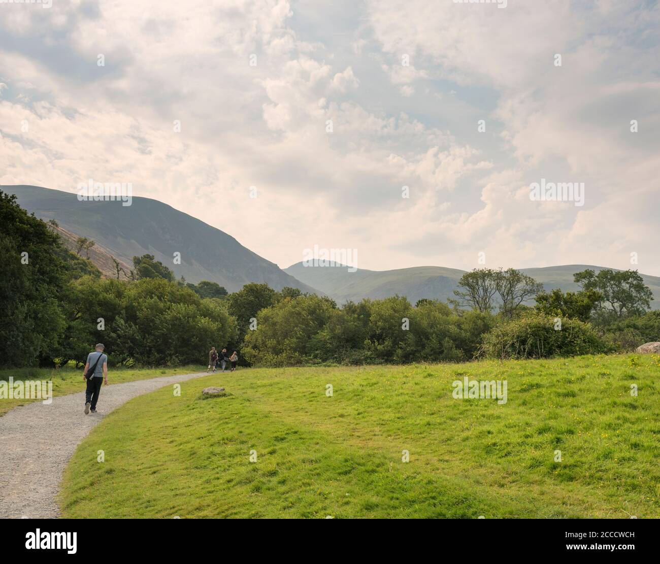 People walking along a footpath leading towards the Snowdonia National ...
