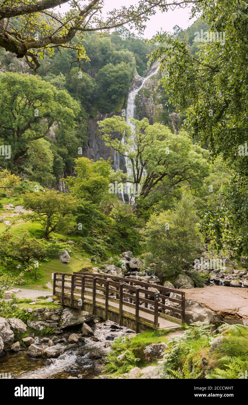 A wooden footbridge crossing the popular Aber water falls situated in ...