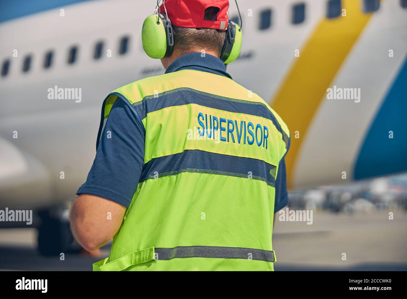 Man in workwear inspecting an air vehicle Stock Photo - Alamy