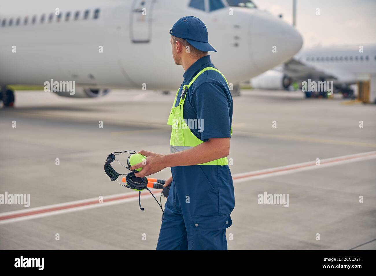 Signalman in uniform standing at the airdrome Stock Photo - Alamy
