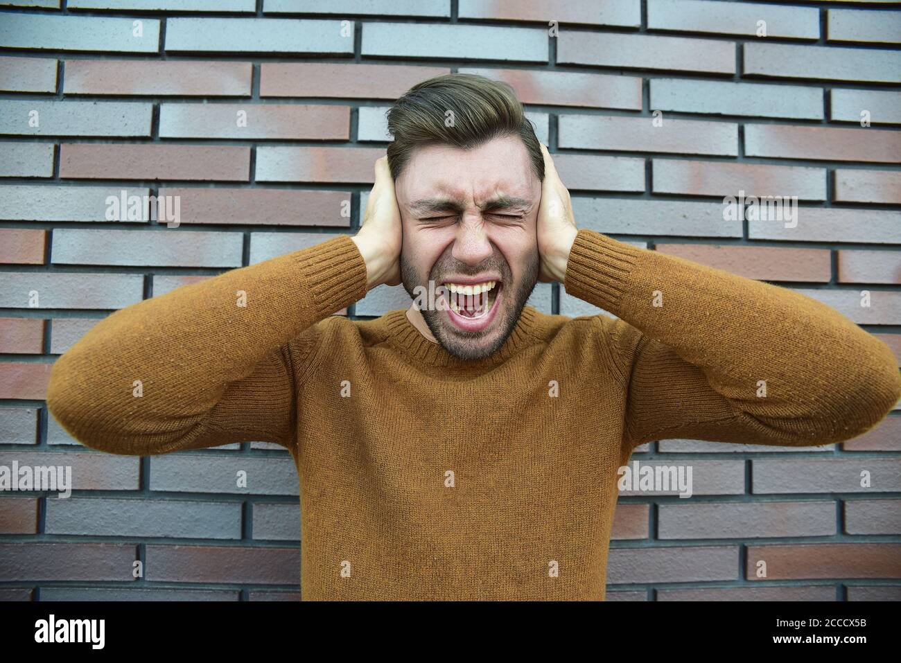 Man feeling painful emotions, screaming, witnessing death of close ...