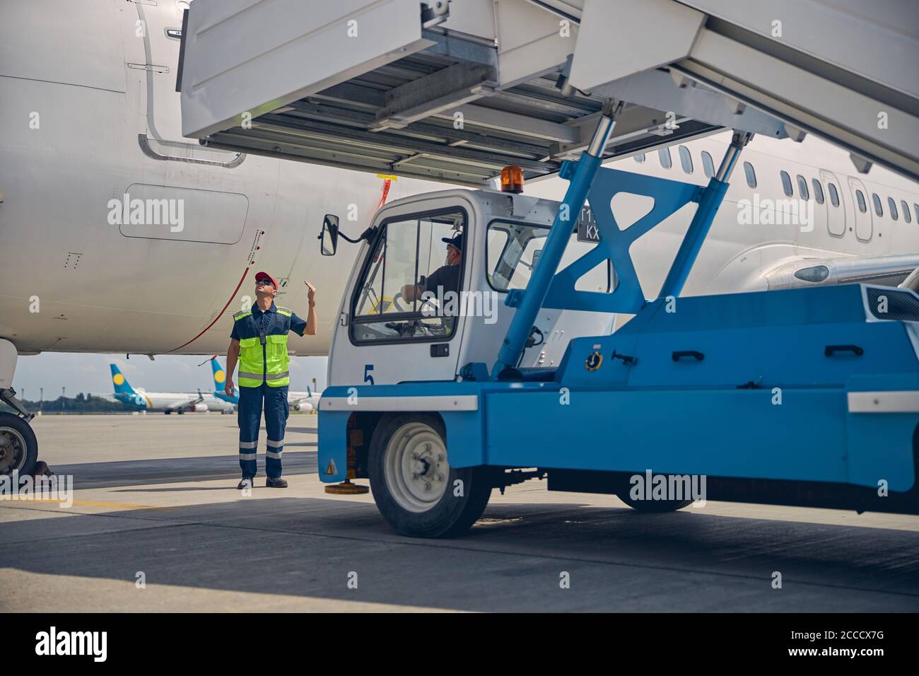 Skilled ground crew installing the aircraft steps Stock Photo - Alamy