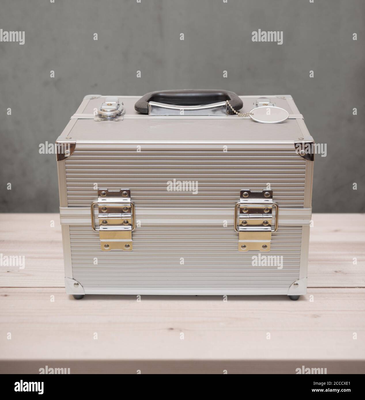 Modern metal box on grunge background Stock Photo - Alamy