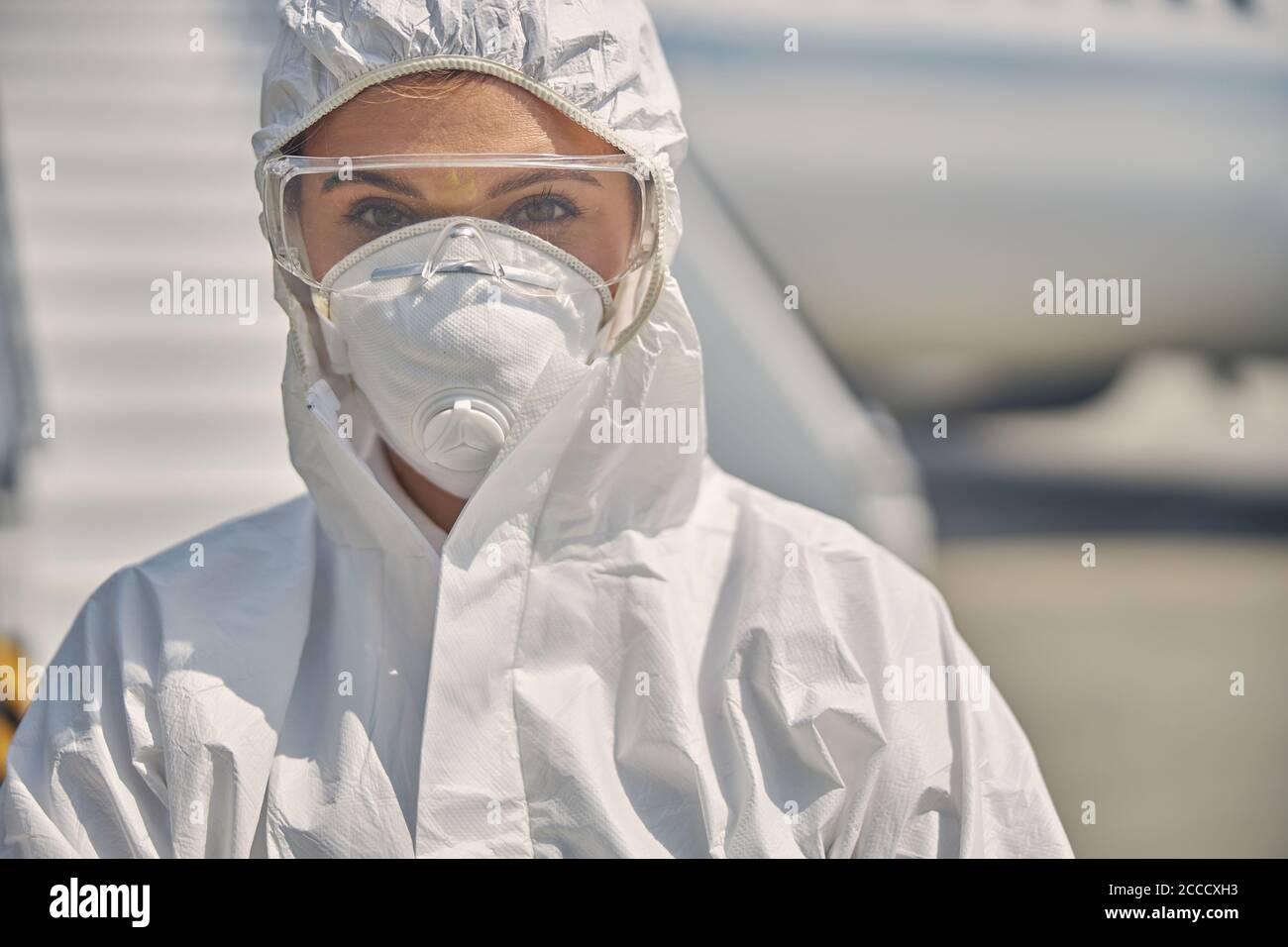 Woman wearing safety goggles and a mask Stock Photo - Alamy