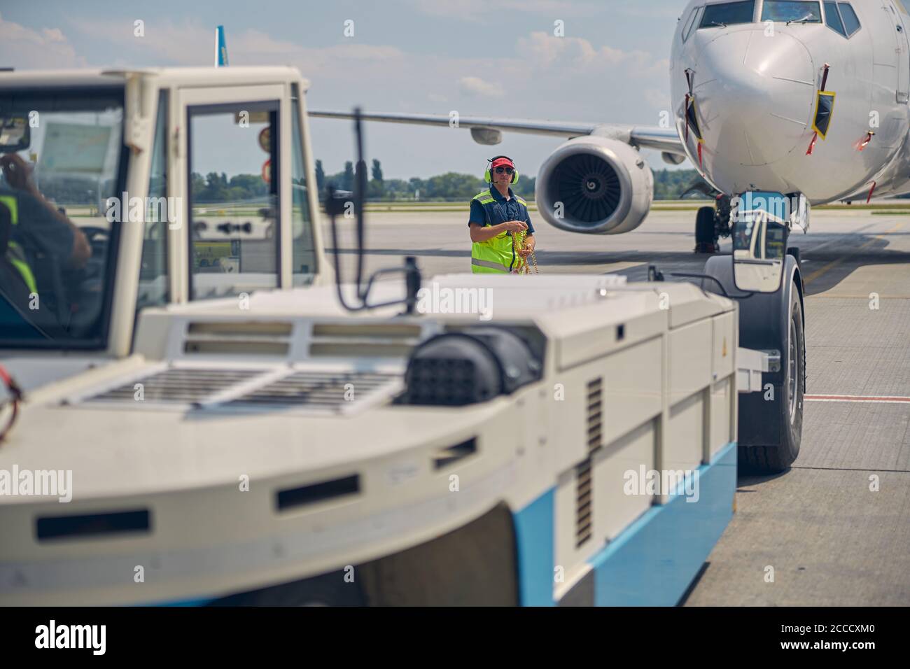 Airport ground crew with headphones hi-res stock photography and images ...