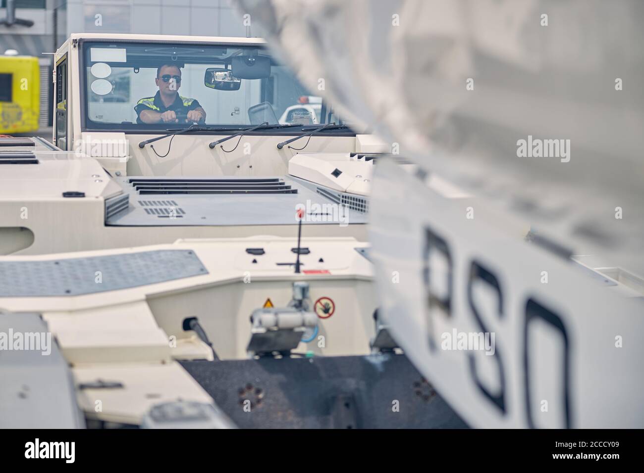 Focused operator sitting in a ground vehicle Stock Photo - Alamy