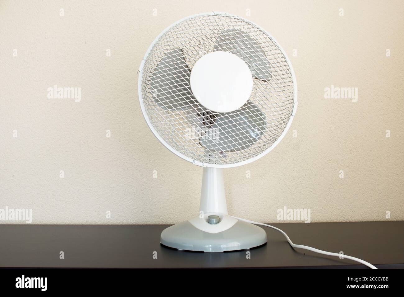 Fan for cooling wind during a hot day in front of a white wall Stock ...