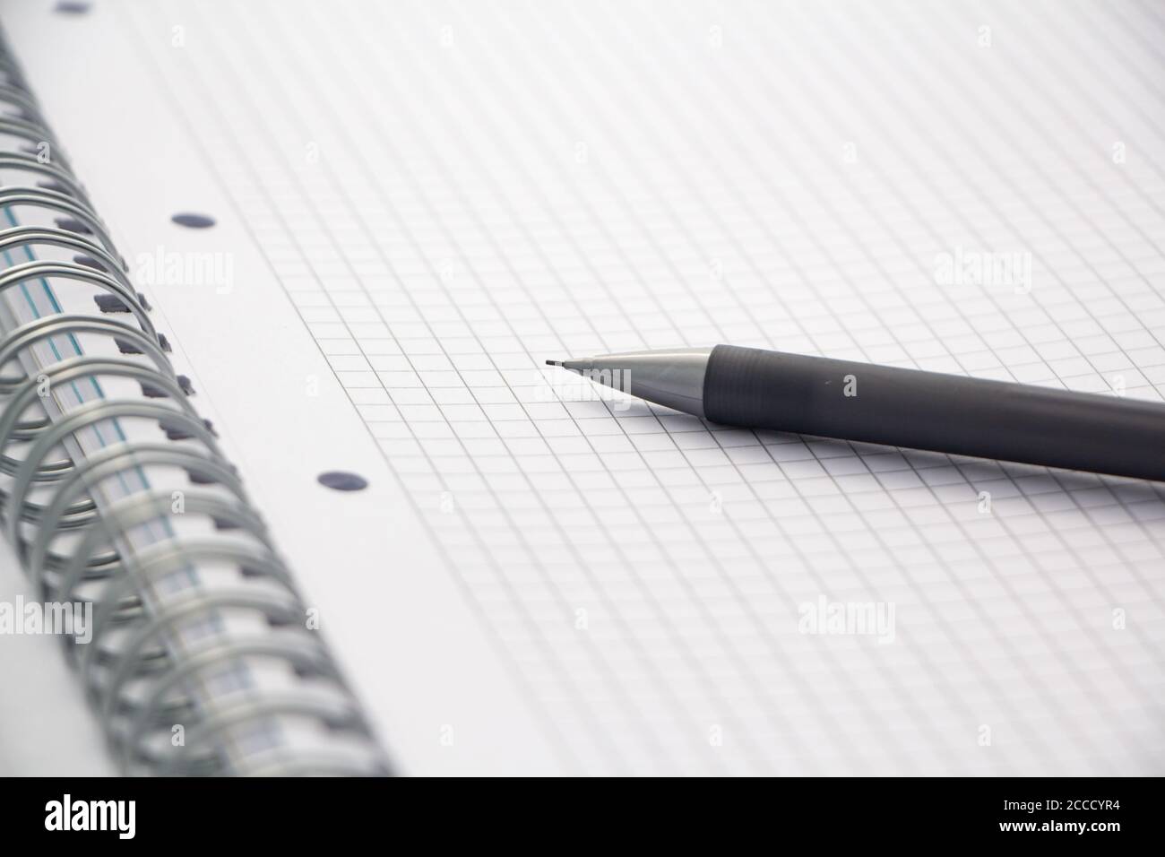 Modern pencil on blank page of notebook, office background Stock Photo ...