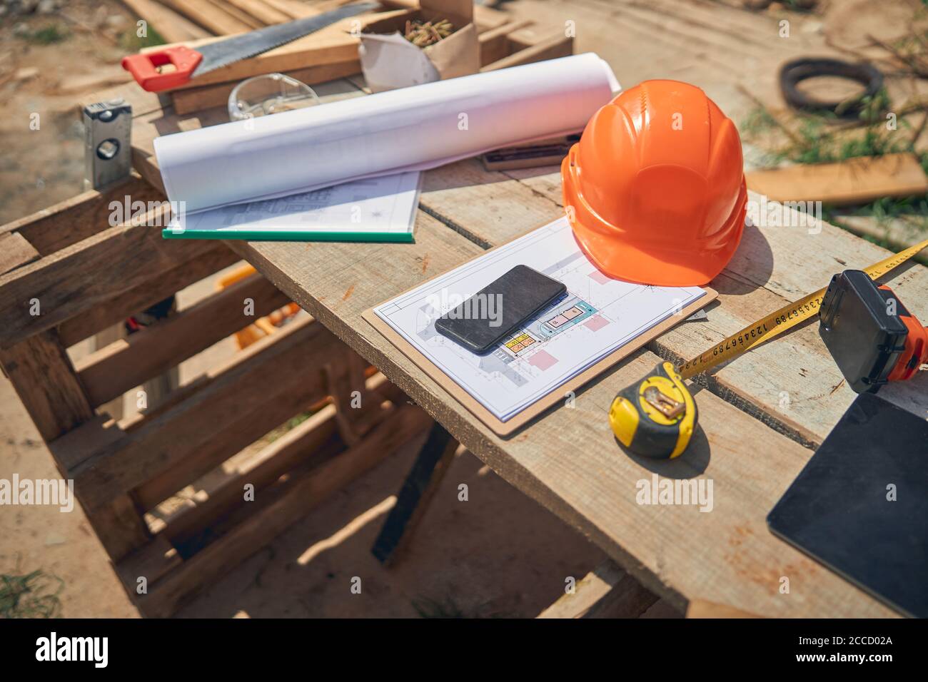 Builder safety helmet and constructor worker tools Stock Photo - Alamy