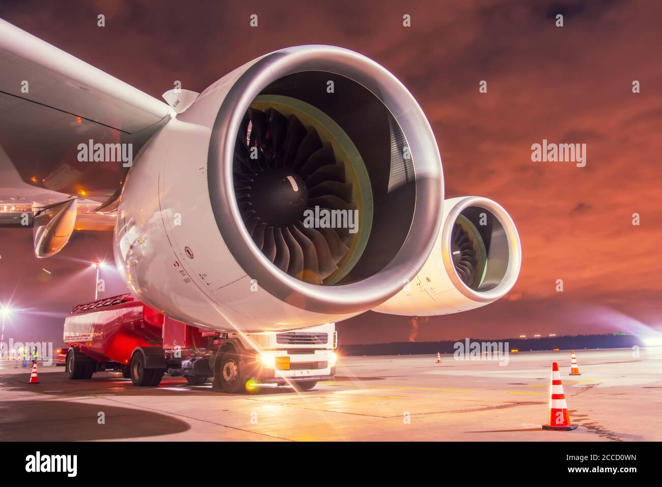 Two engines under the wing of a huge airplane parked at the airport at ...