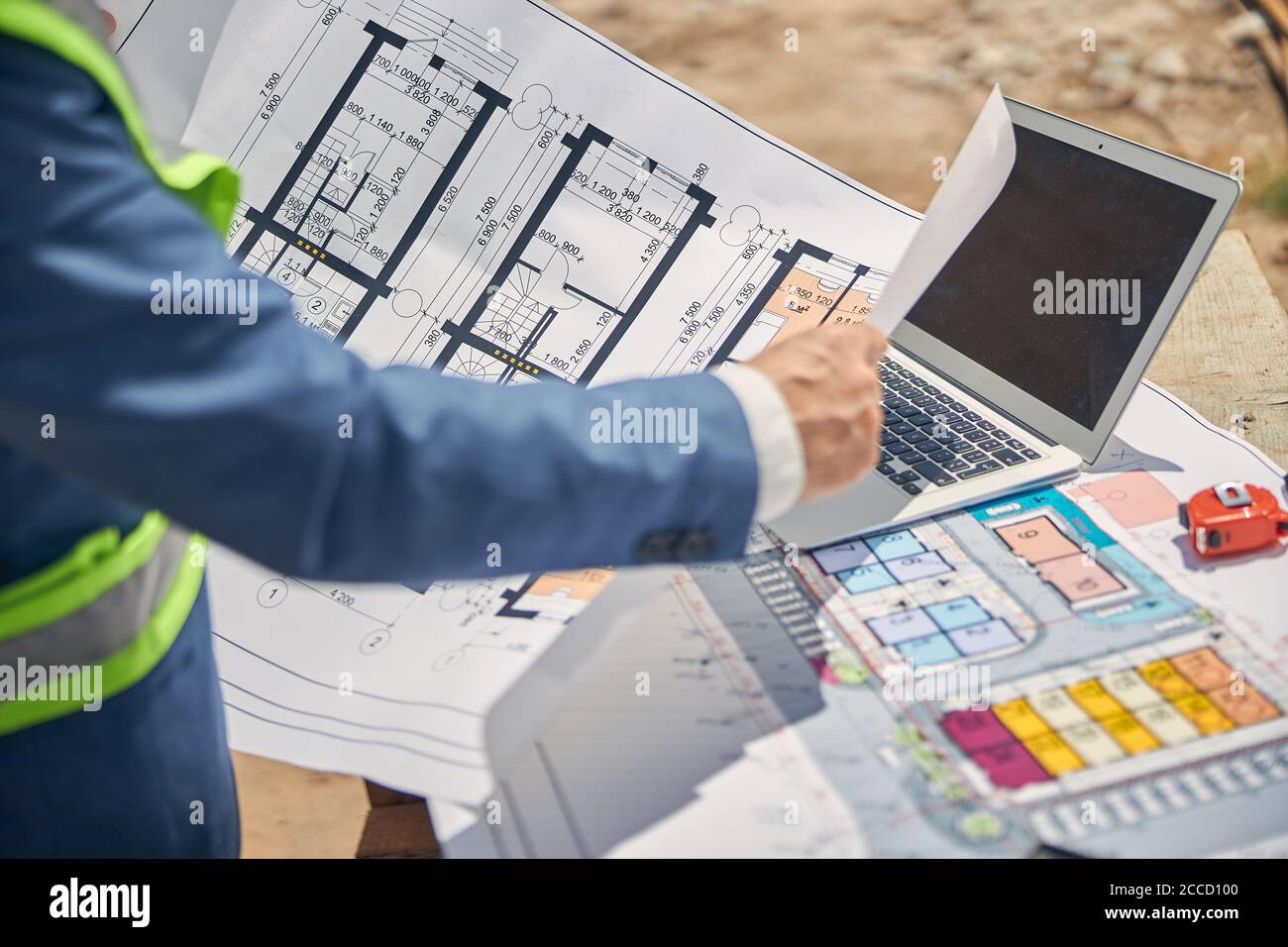 Male constructor working on a technical drawing Stock Photo - Alamy