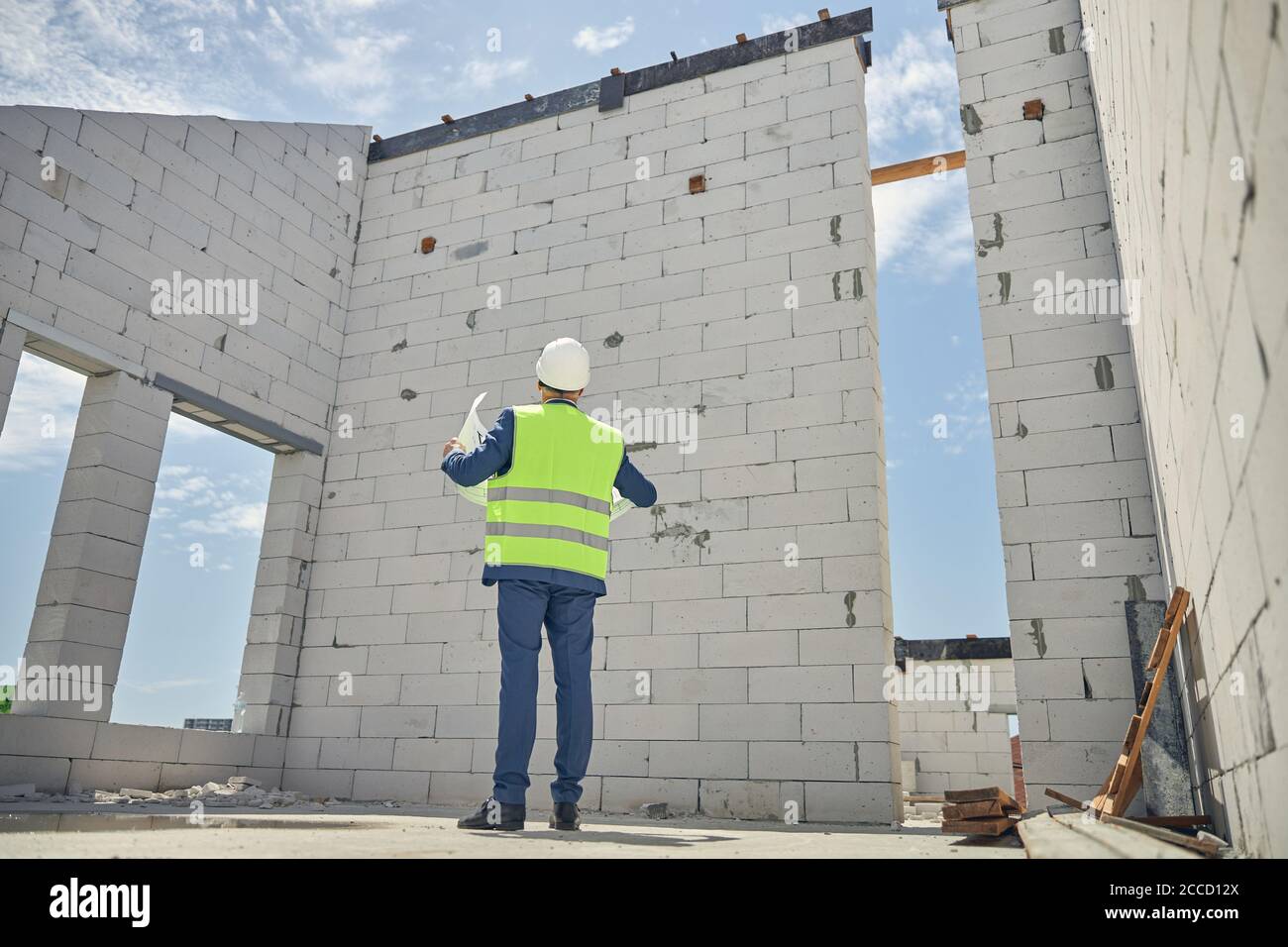 Man holding technical drawings in his hands Stock Photo - Alamy