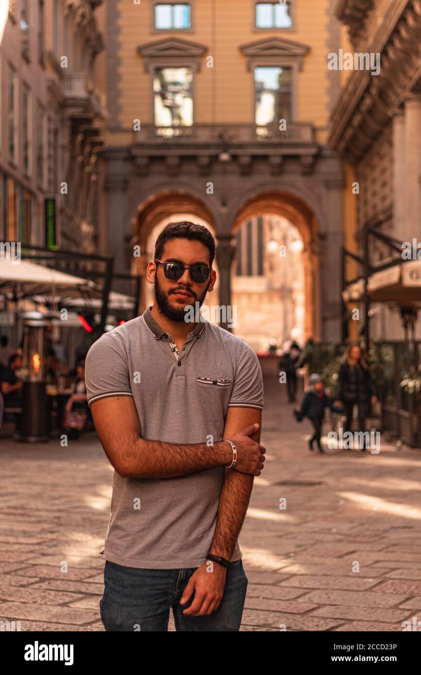 Young attractive Latin male posing at camera outdoors Stock Photo - Alamy