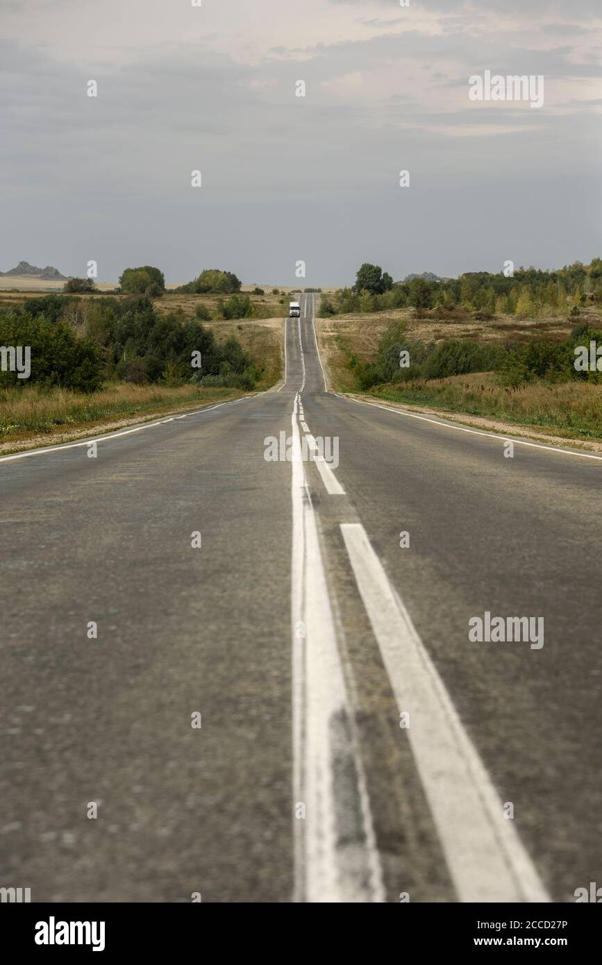Double solid line on a country road Stock Photo - Alamy