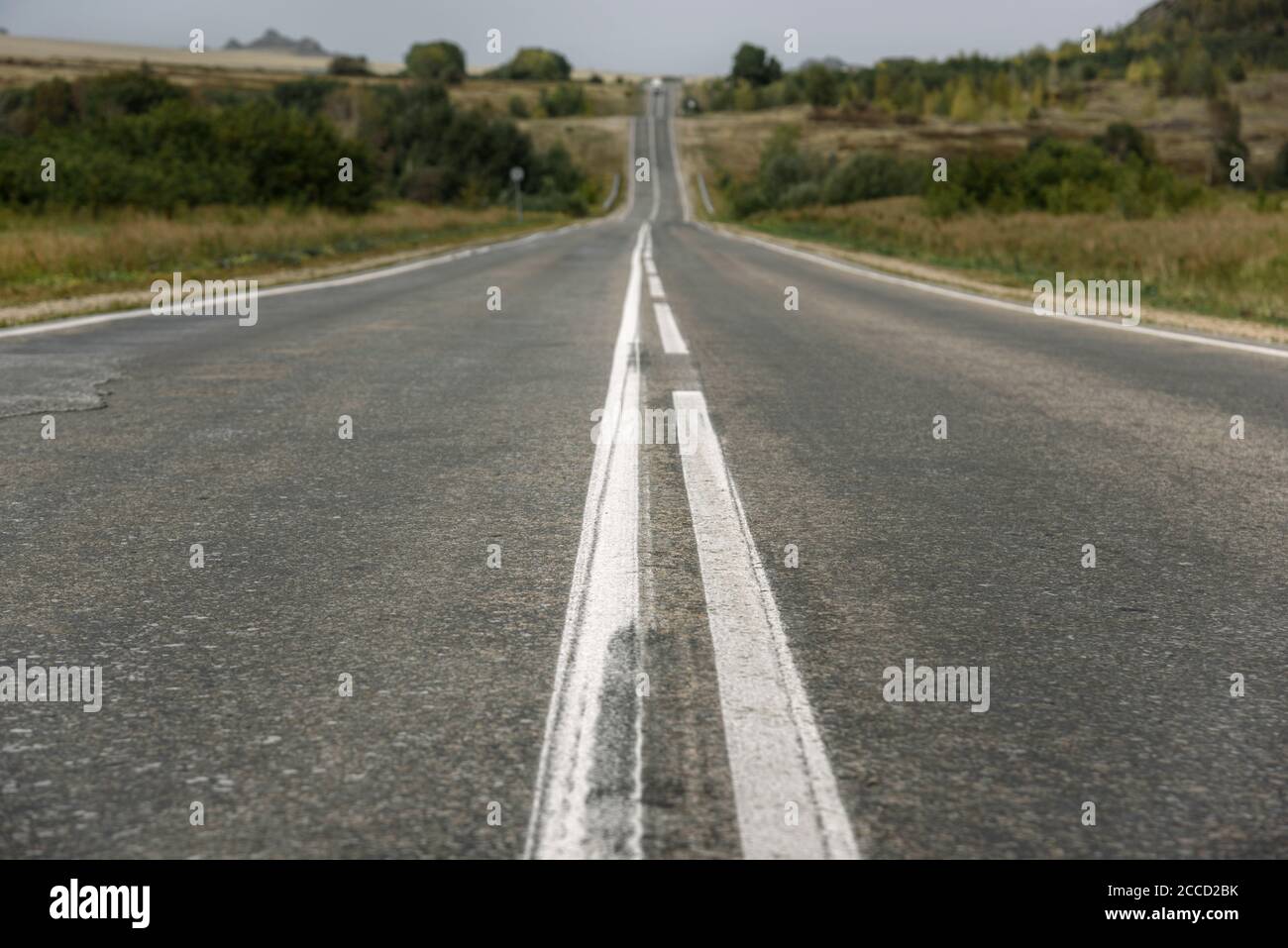 Double solid line on a country road Stock Photo - Alamy