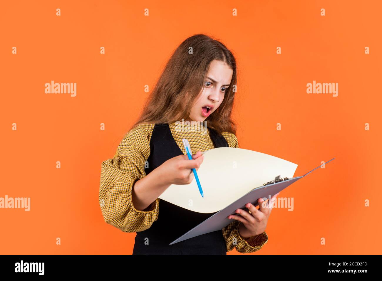 failed again. child is working with paper. paperwork concept. ready for ...