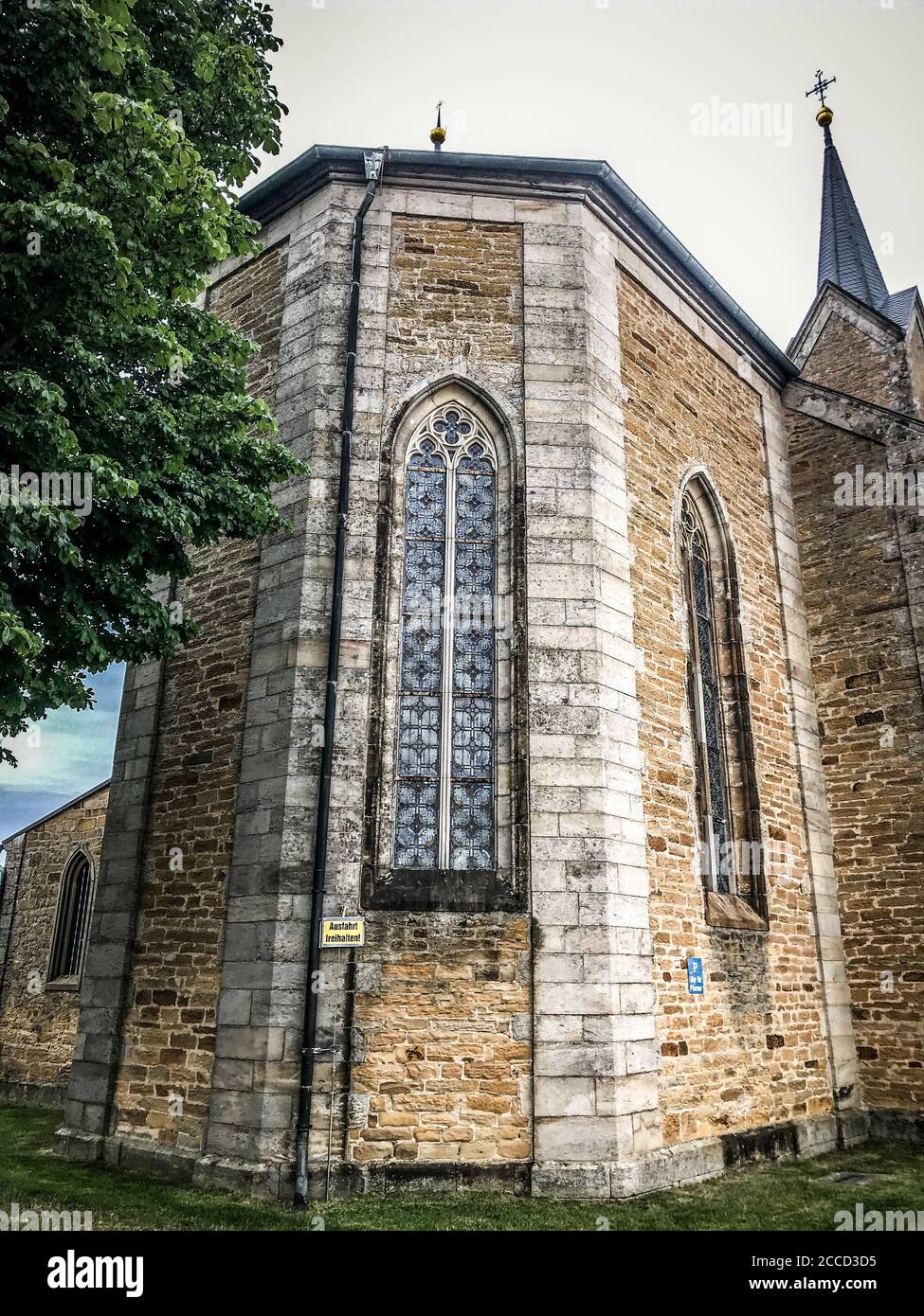 Vertical low angle shot of a medieval building with brick walls Stock ...
