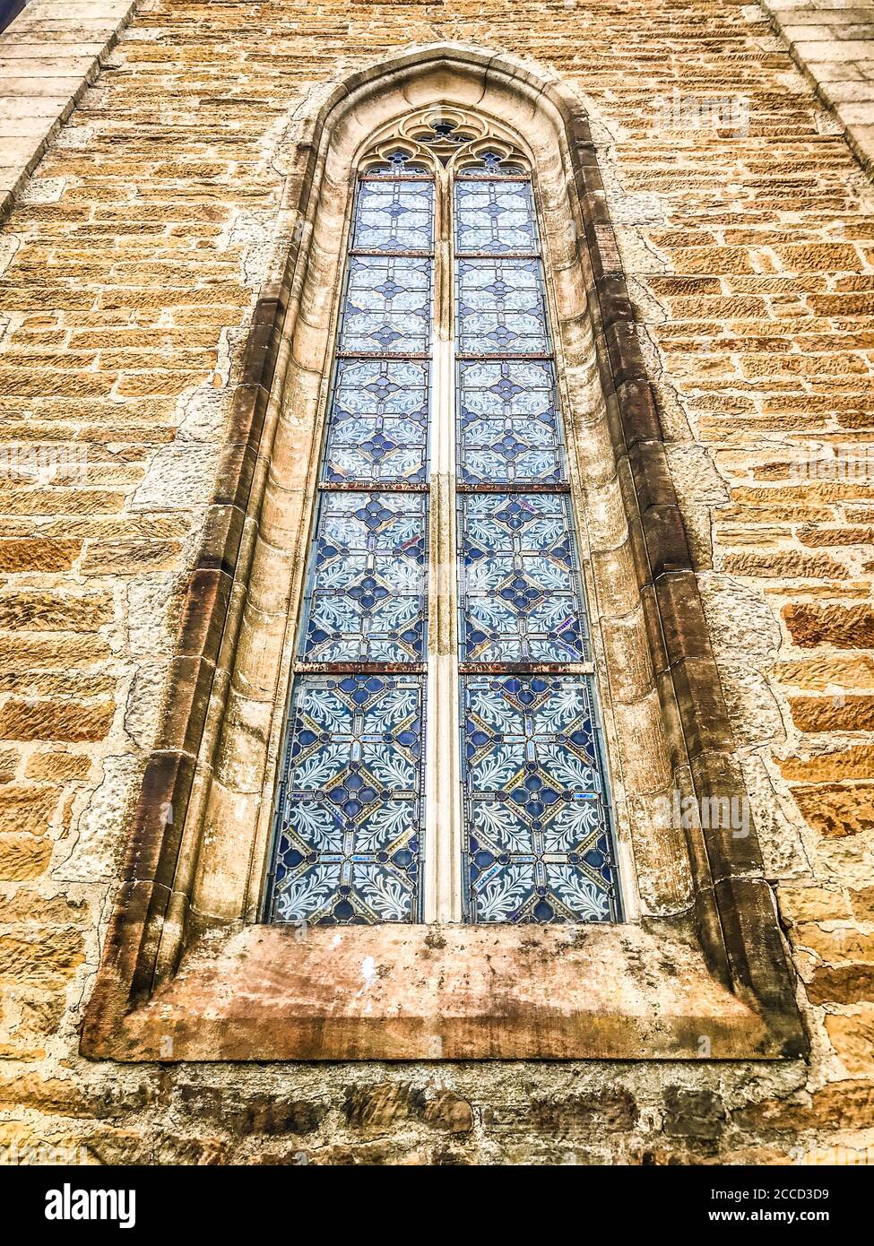 Vertical low angle shot of a medieval building with brick walls Stock ...