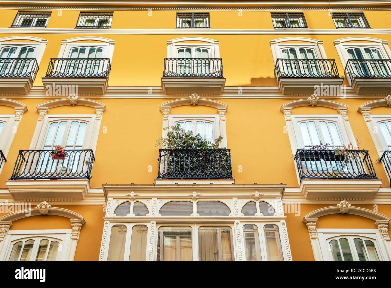 Bright facade of a typical old Mediterranean building painted in bright ...