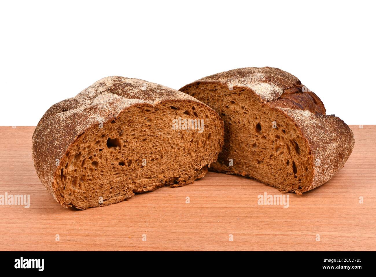 Freshly baked loaves of traditional round rye bread isolated on white ...