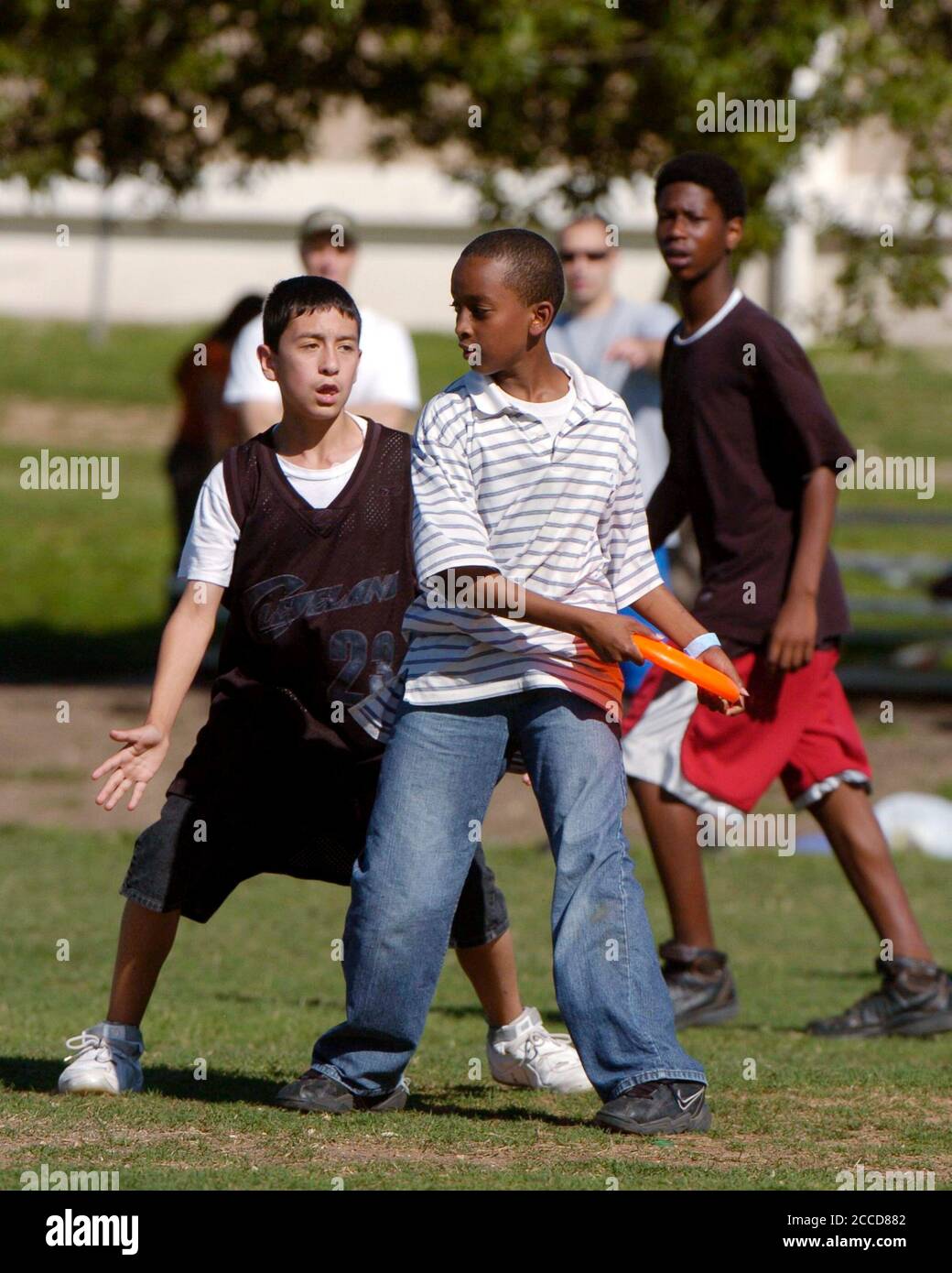 Diverse children playing football hi-res stock photography and images ...