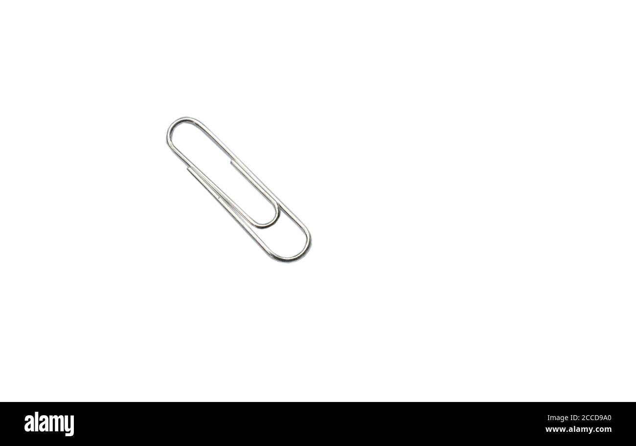 Silver paper clip on white background Stock Photo - Alamy