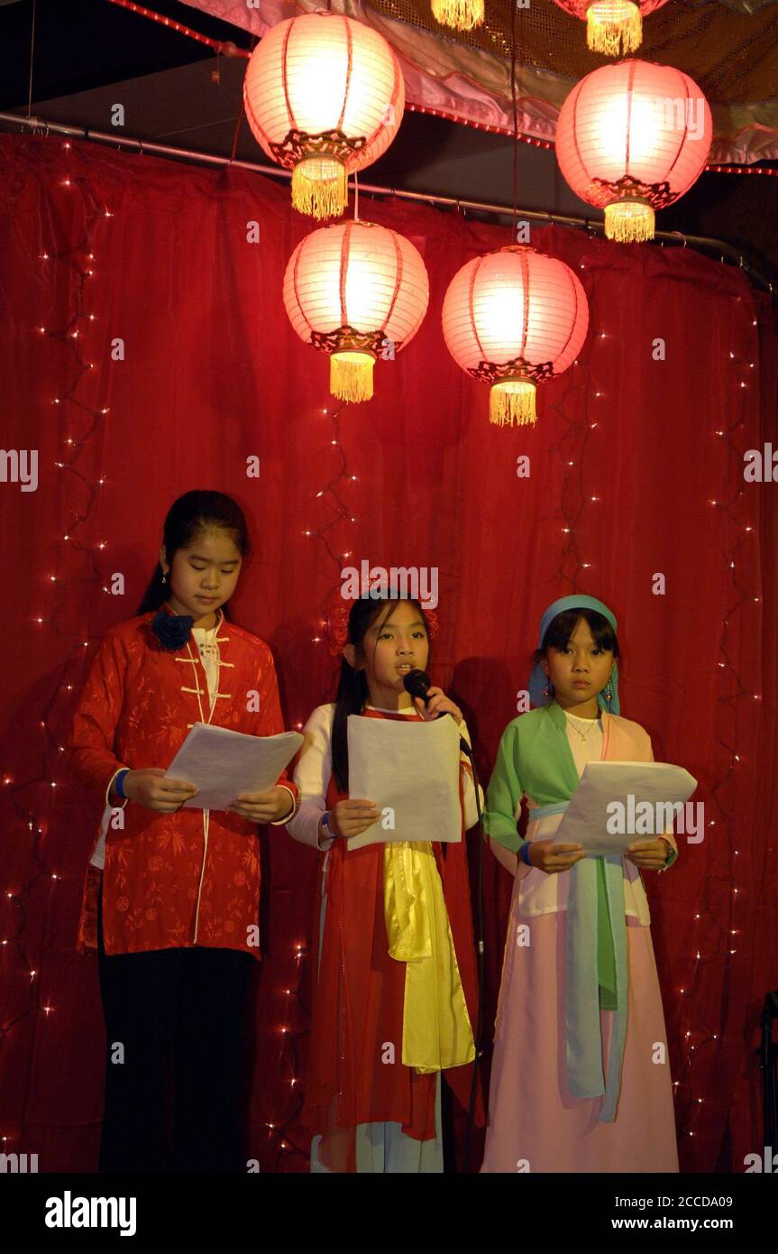 Asian child speaking into a microphone hi-res stock photography and ...