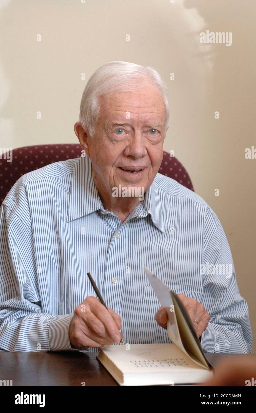 Austin, TX December 14, 2006: Former U.S. President Jimmy Carter signs ...