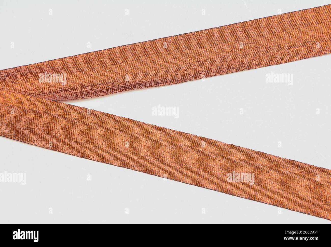 Bronze ribbon isolated on a white background Stock Photo - Alamy