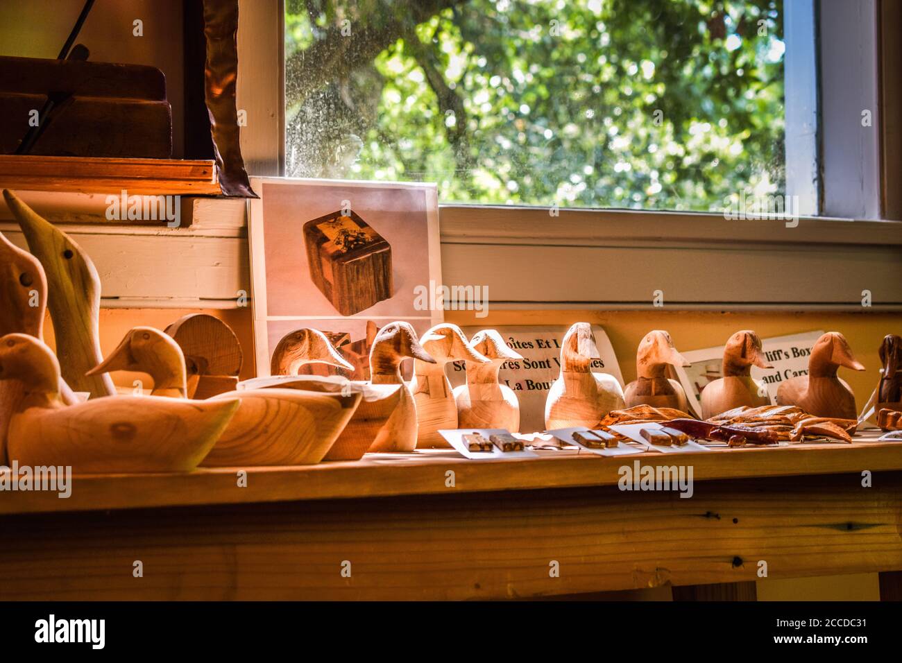 A group of wooden ducks on a window sill with no people in it Stock ...