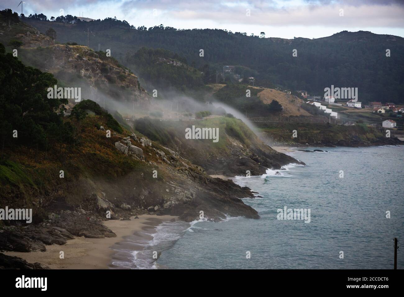 the mist descends a cliff into the sea Stock Photo - Alamy