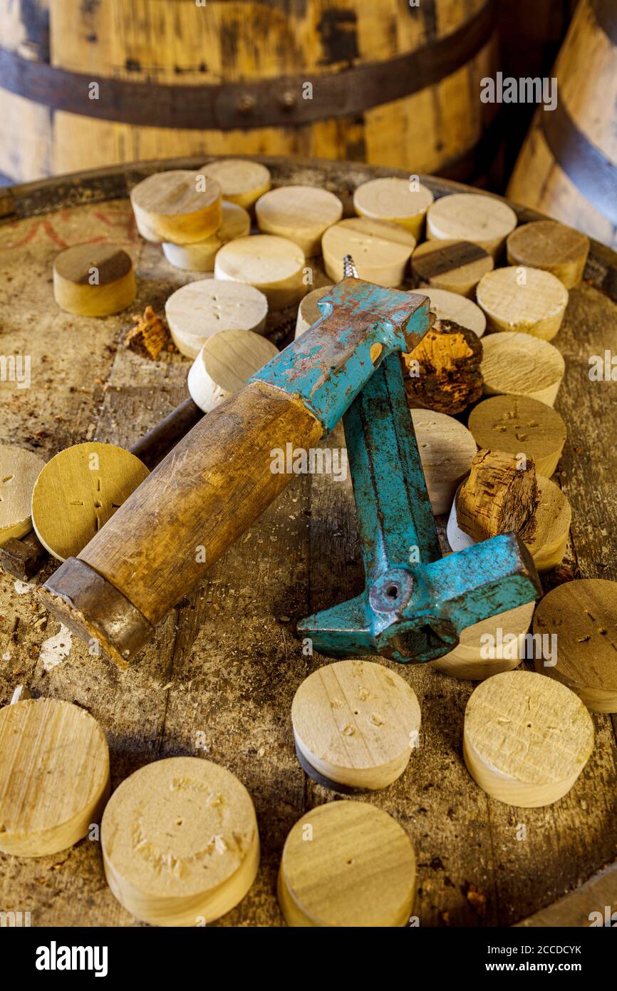 Tools to insert and remove bungs from whisky barrels, on the top of a ...