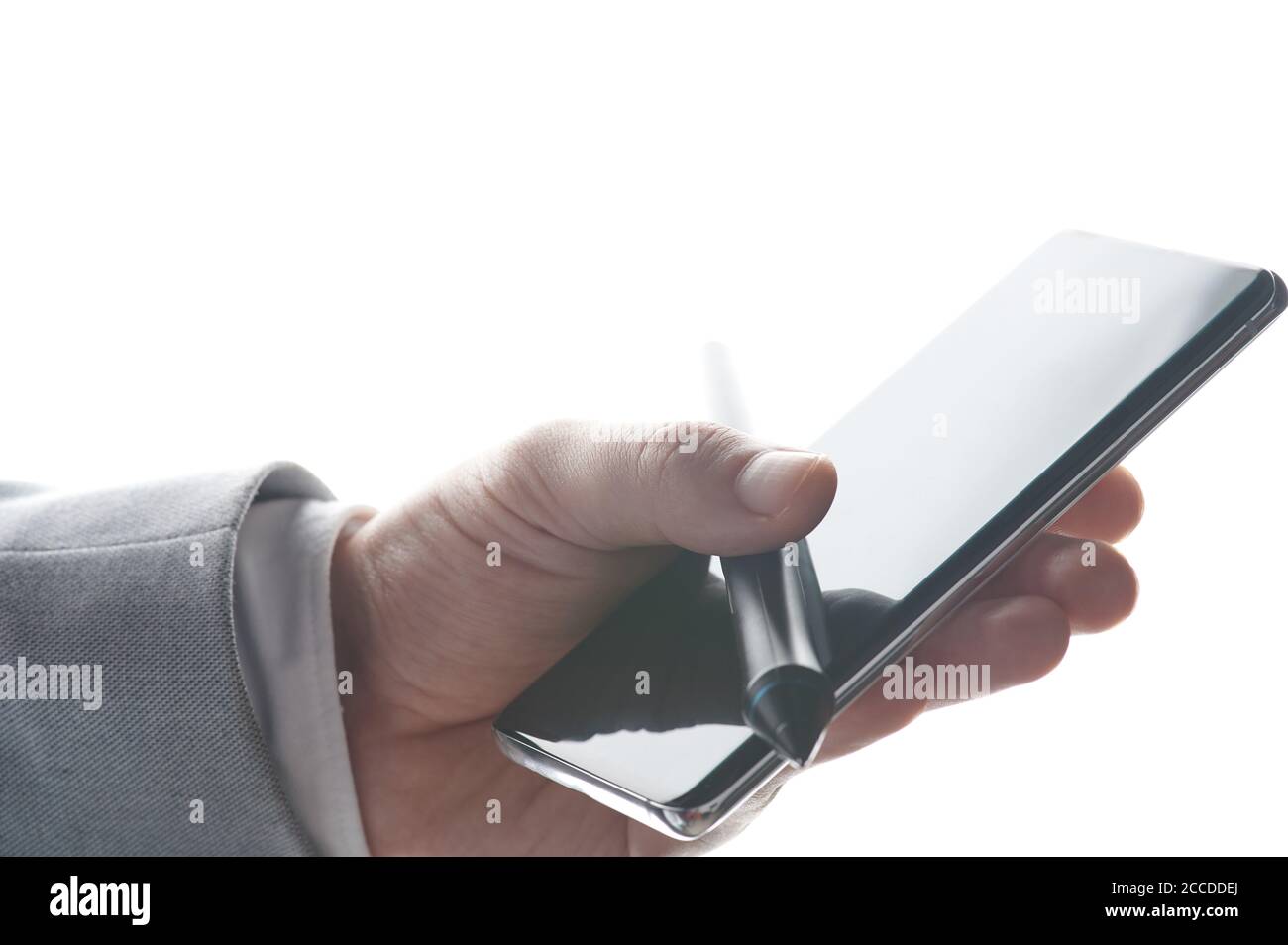 Smartphone with stylus in businessman hand isolated on white background ...