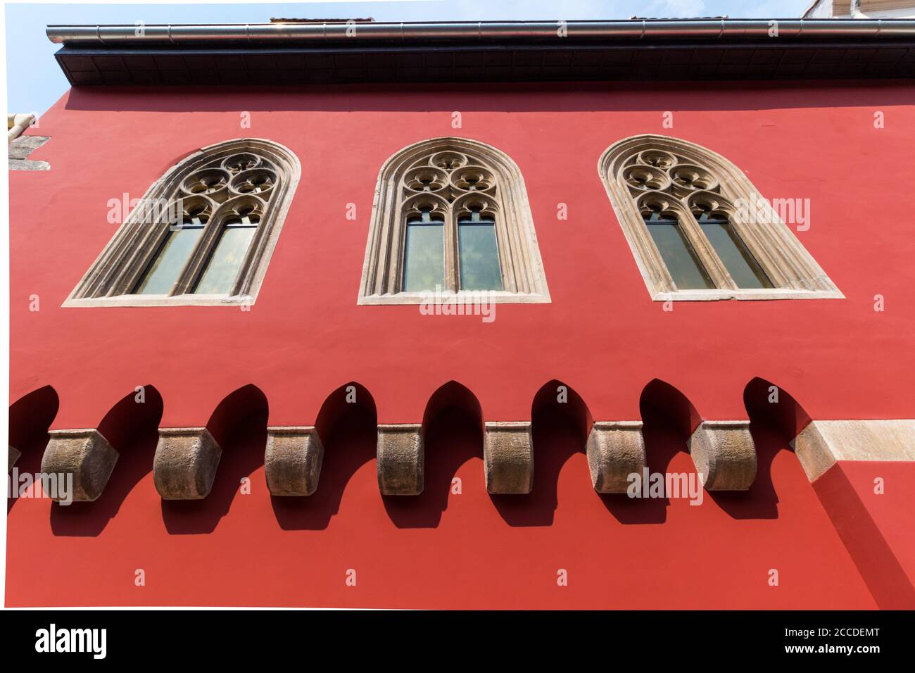 Medieval Gothic stone window frames on red facade, 16 Uj utca, Sopron ...