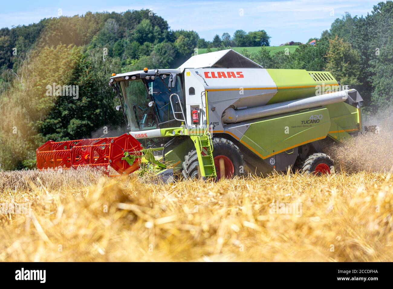 BAVARIA / GERMANY - AUGUST 20, 2020: Claas Tucano 420 combine harvester ...